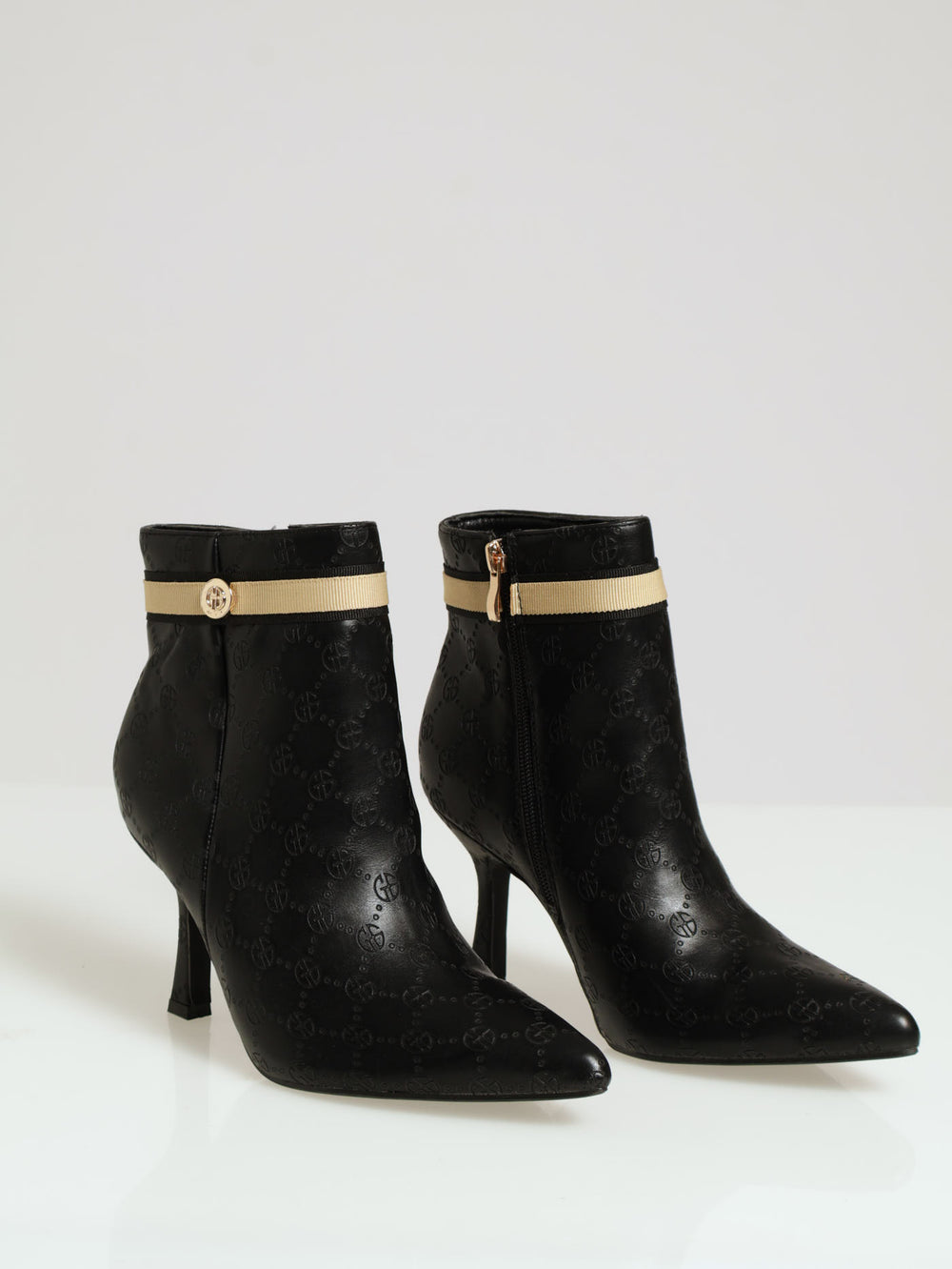 Heeled Ankle Monogram Embossed Boot - Black – LEGiT